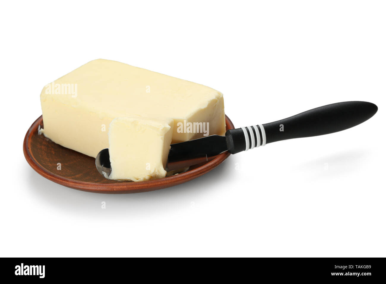 Plate with butter and knife on white background Stock Photo - Alamy