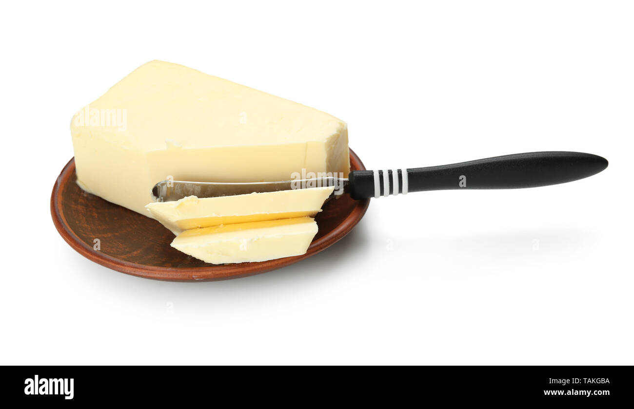 Plate with butter and knife on white background Stock Photo - Alamy