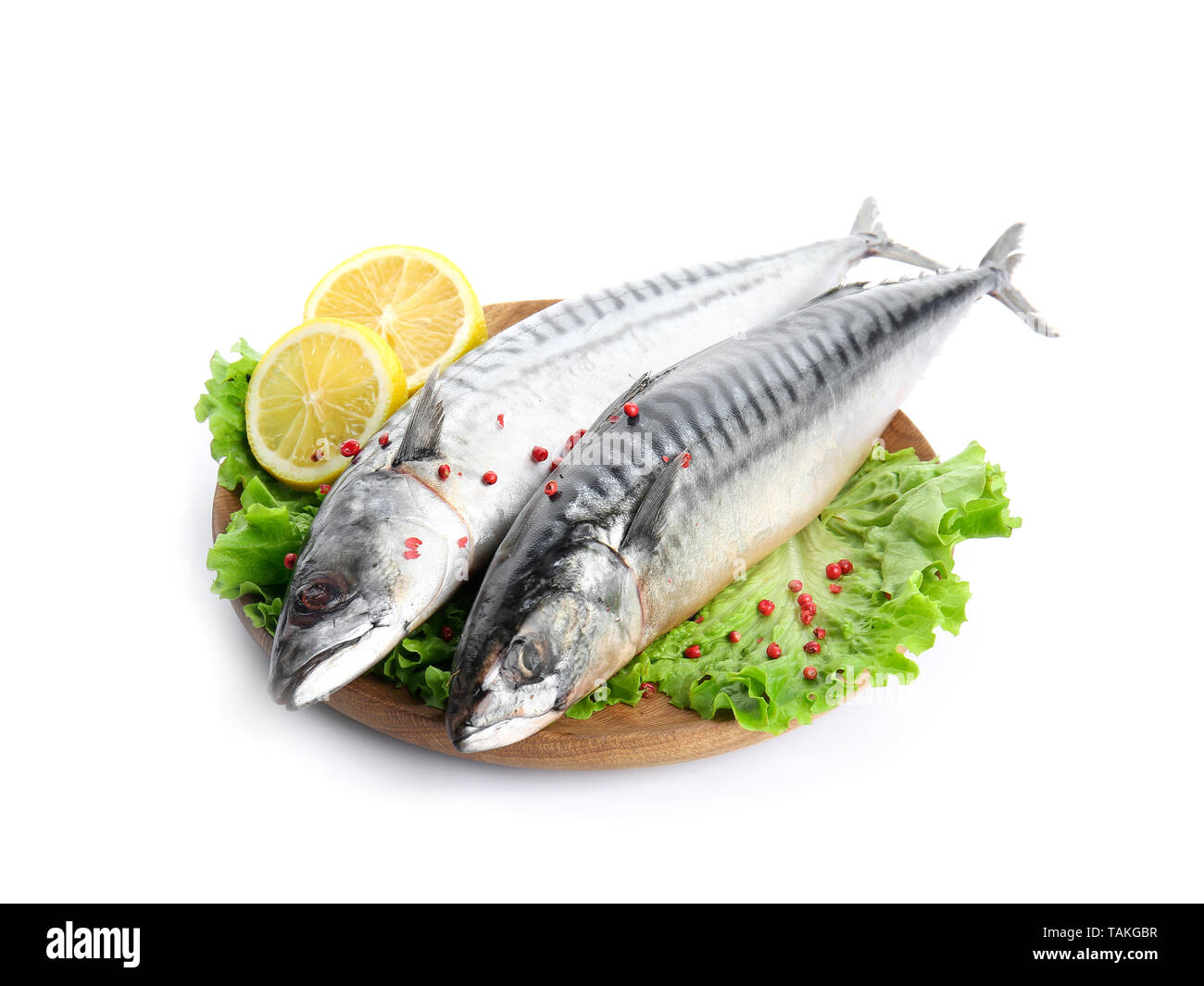 Wooden plate with tasty raw mackerel fish on white background Stock ...