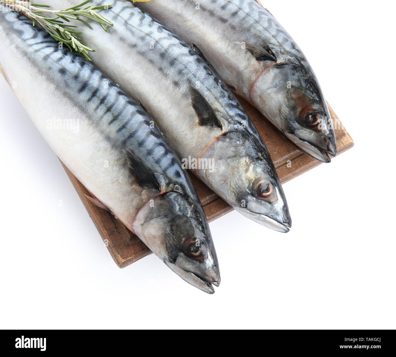 Wooden board with tasty raw mackerel fish on white background Stock ...