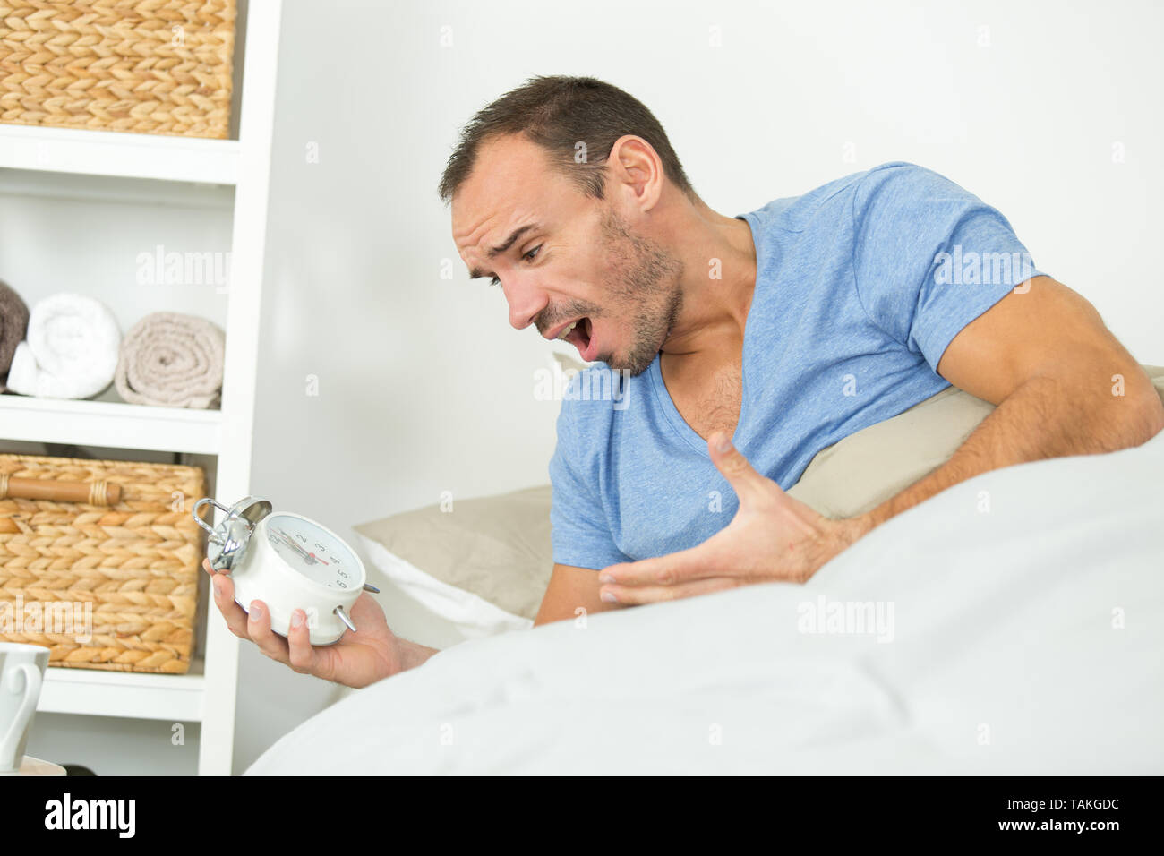 man waking up late Stock Photo - Alamy