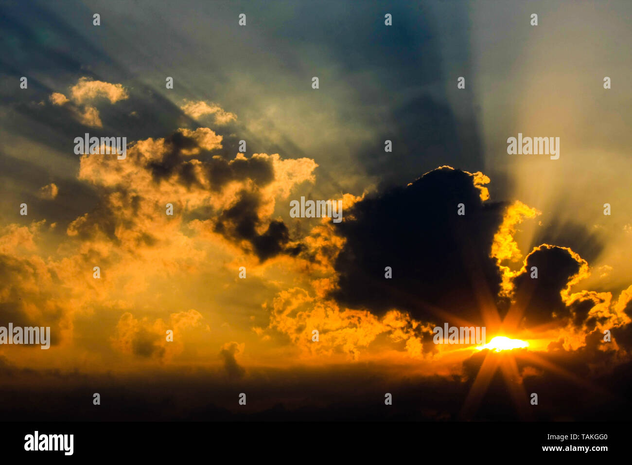 Beautiful, colorful sunshine, sunset sunbeams, sun ray on the blue sky ...