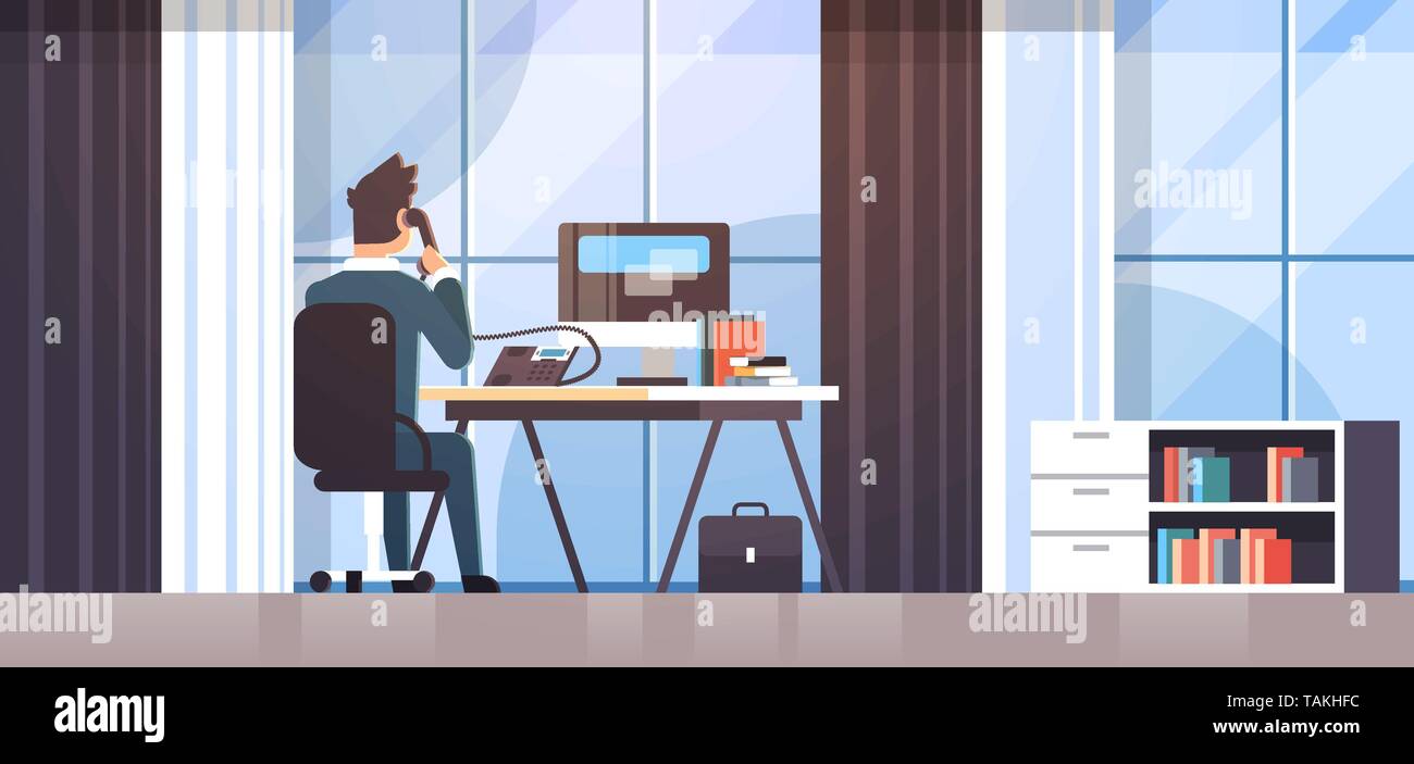 businessman sitting at workplace desk rear view business man using ...