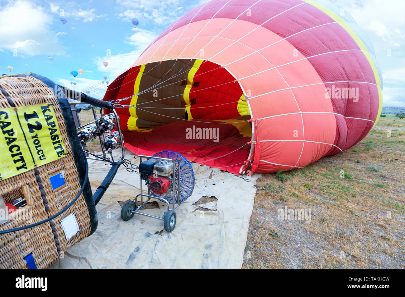 People inflate balloons with a gas torch and a large-capacity gasoline ...