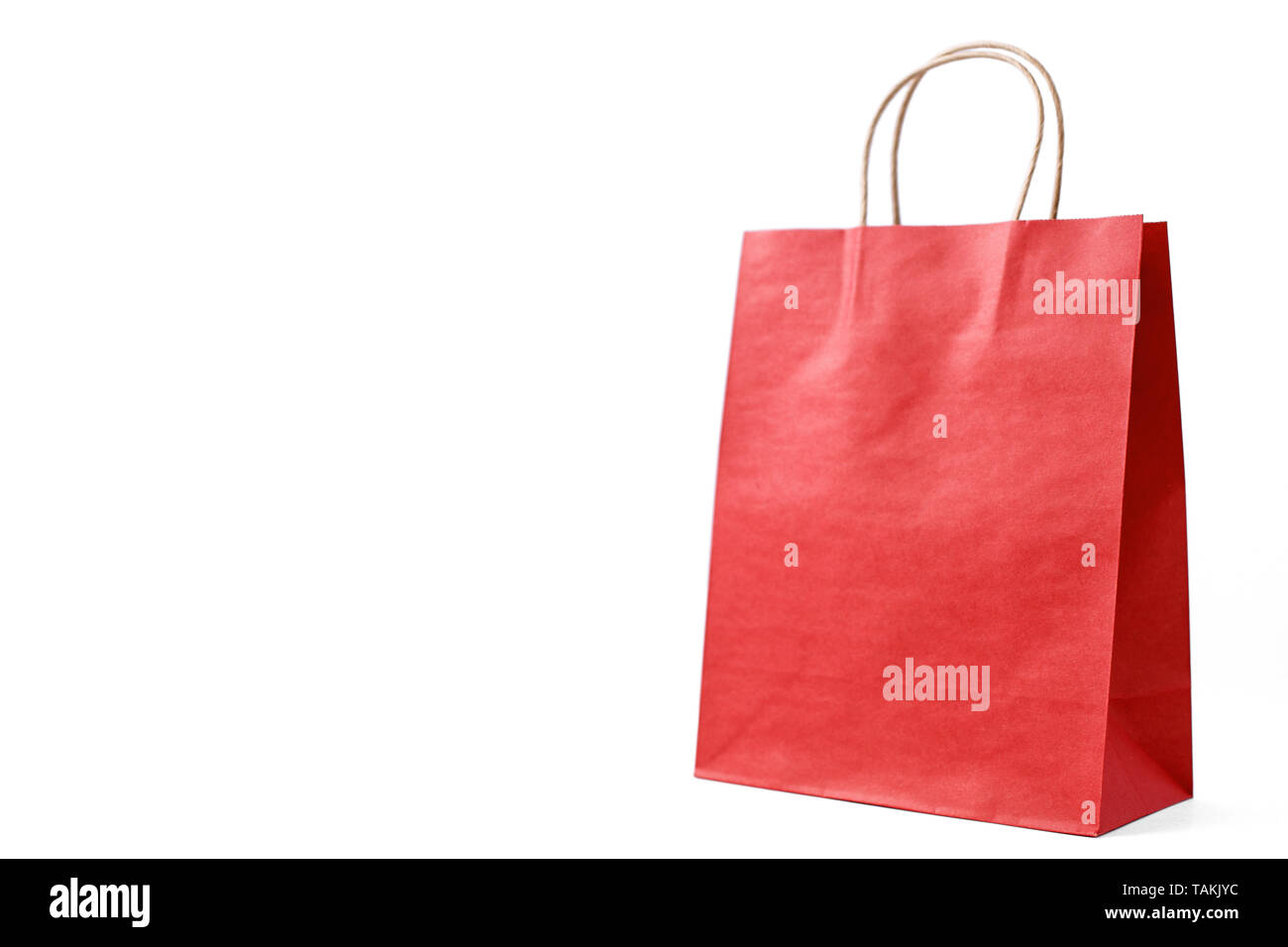 environmentally friendly cardboard red bags on white isolated ...