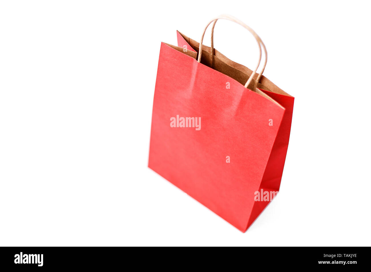 environmentally friendly cardboard red bags on white isolated ...
