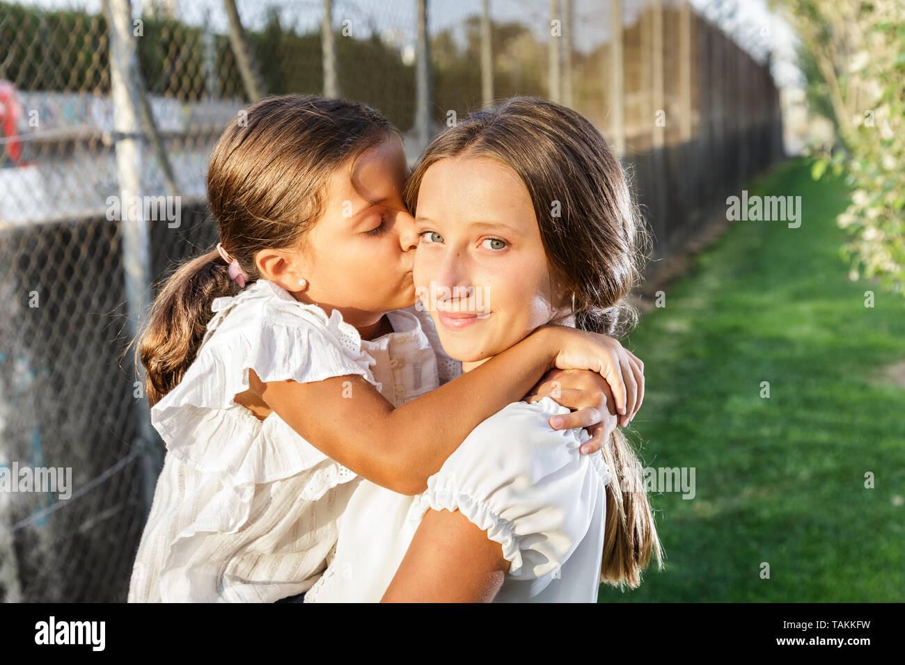 Two sisters kissing High Resolution Stock Photography and Images - Alamy