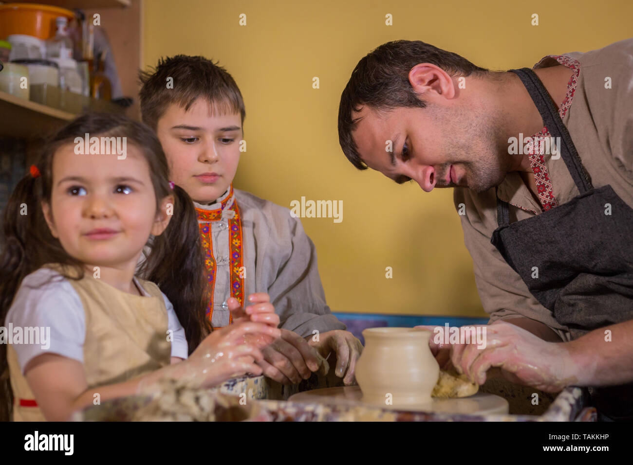 Pottery class and workshop: professional male potter working with ...