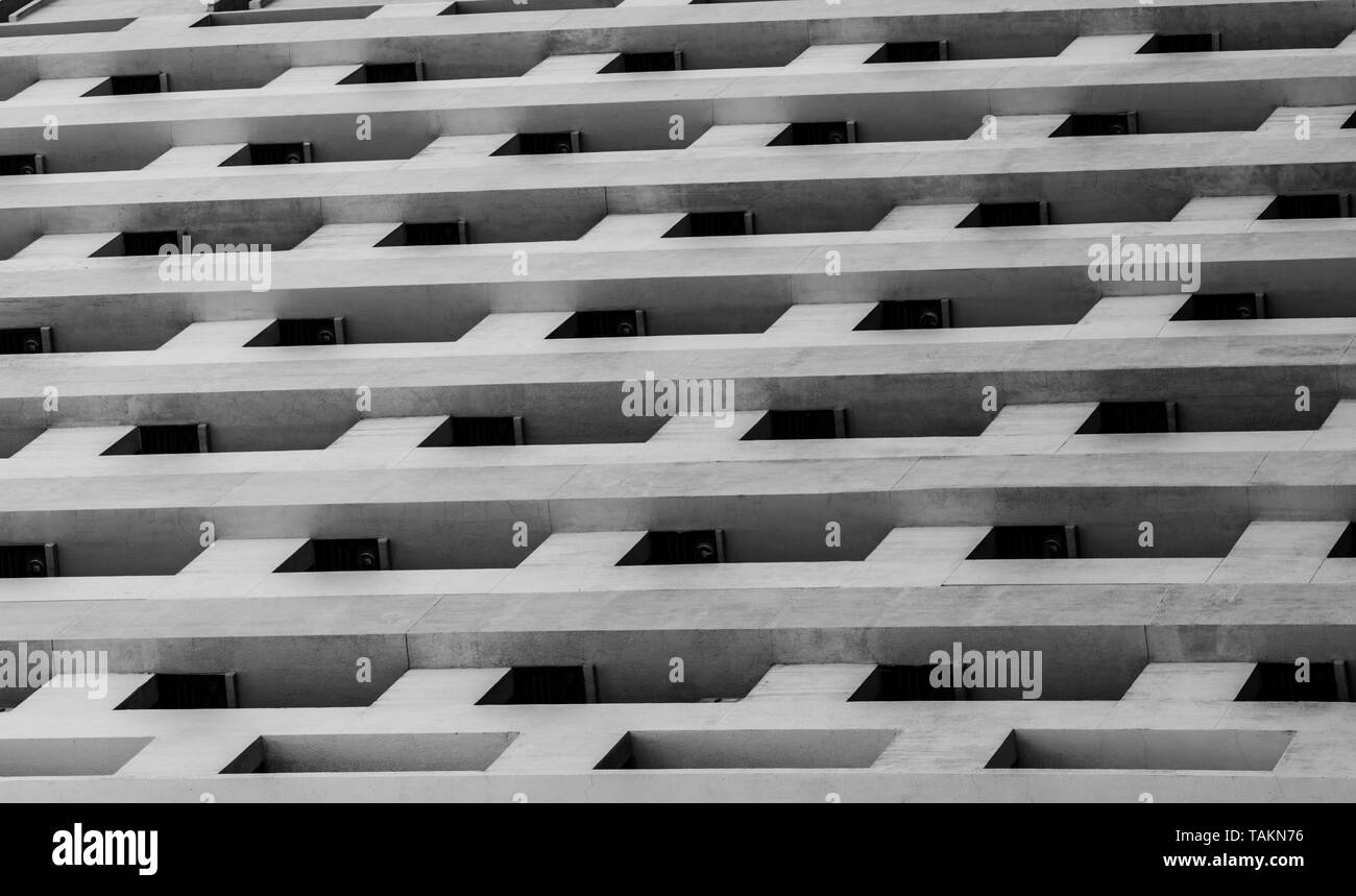 Bottom view of skyscraper concrete building. Looking up view in ...