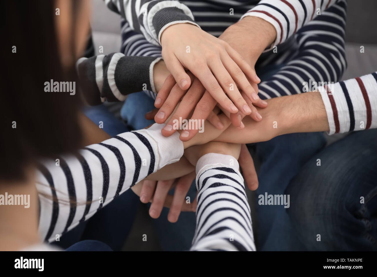 People putting hands together as symbol of unity Stock Photo - Alamy