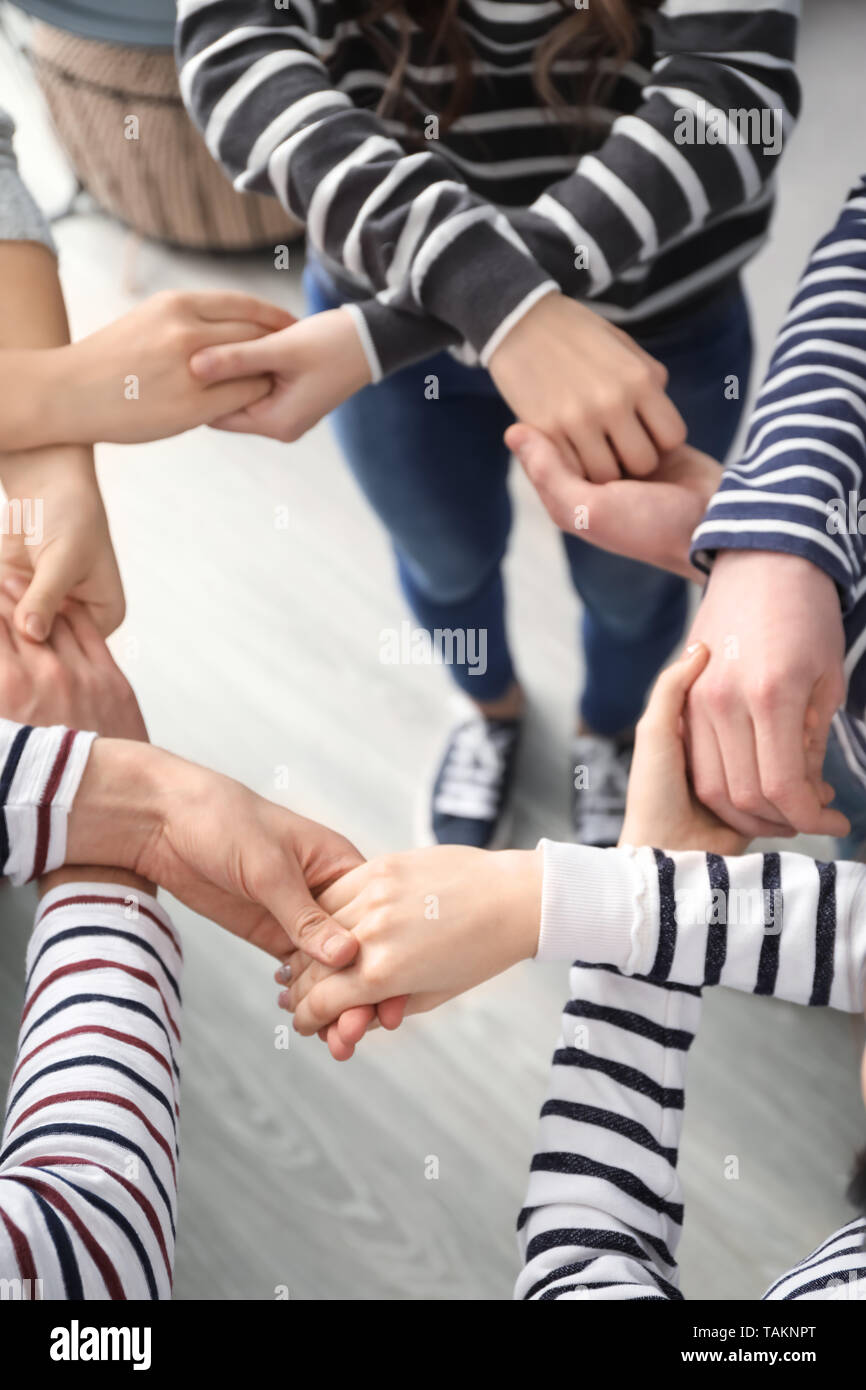 People holding hands together as symbol of support Stock Photo - Alamy