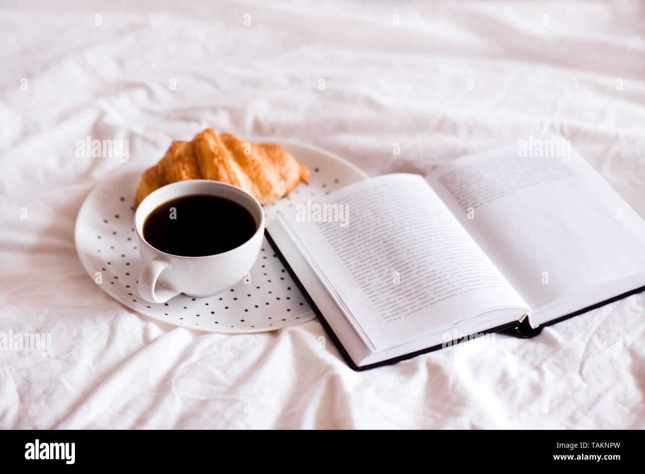 Cup of coffee with cake and open book closeup. Good morning Stock Photo ...