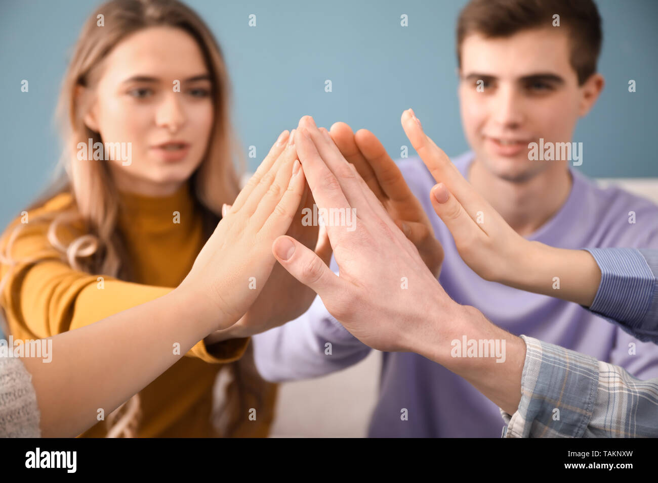 People putting hands together as symbol of unity Stock Photo - Alamy