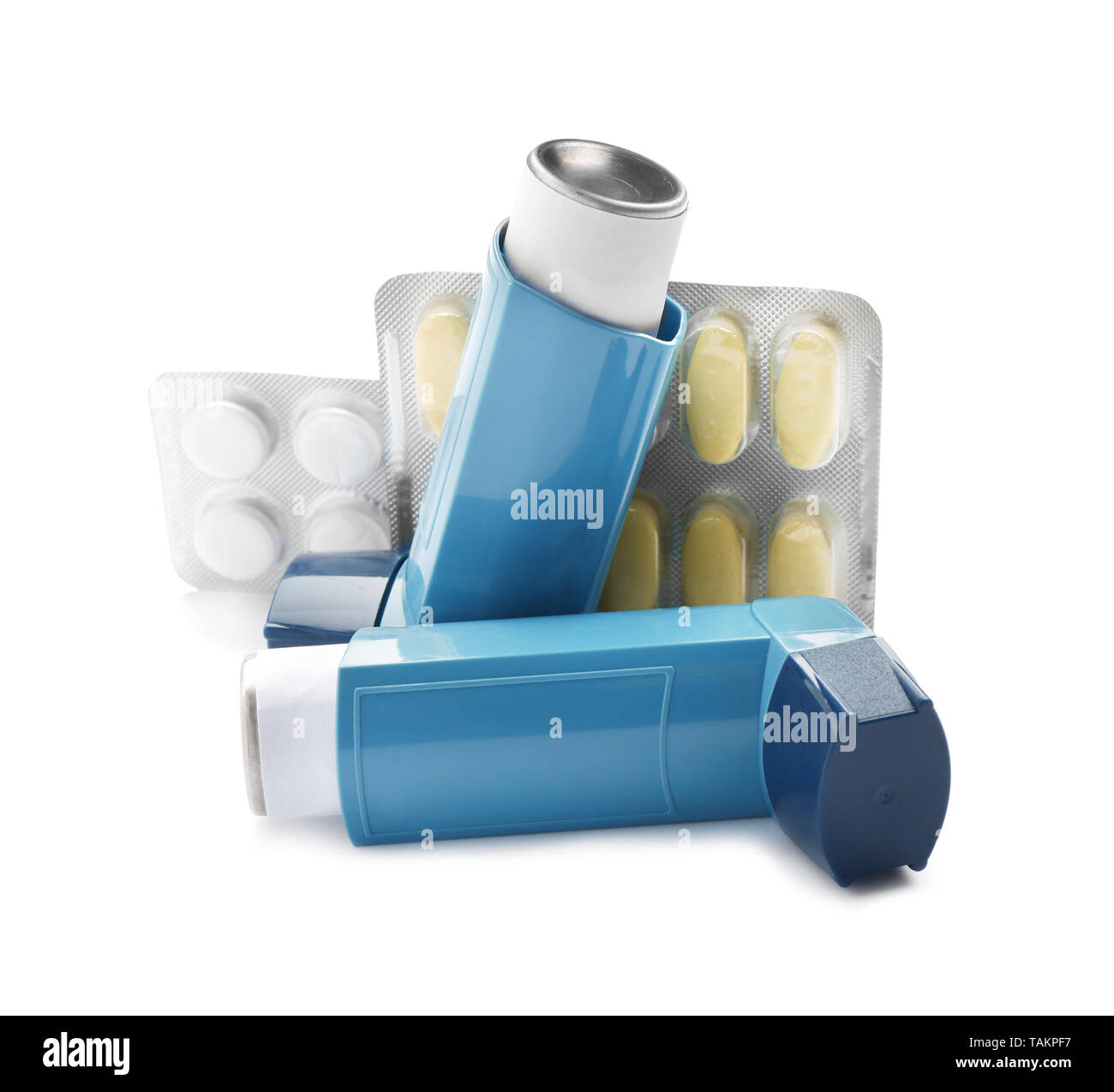 Inhalers and pills on white background Stock Photo - Alamy