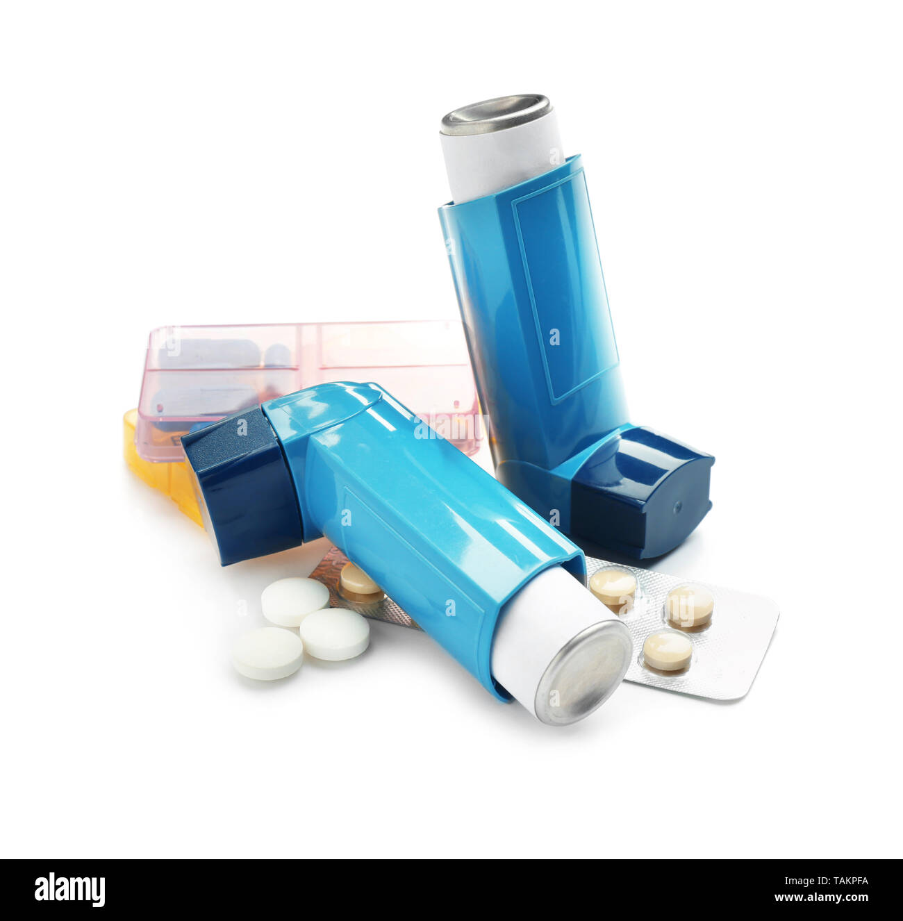 Inhalers and pills on white background Stock Photo - Alamy