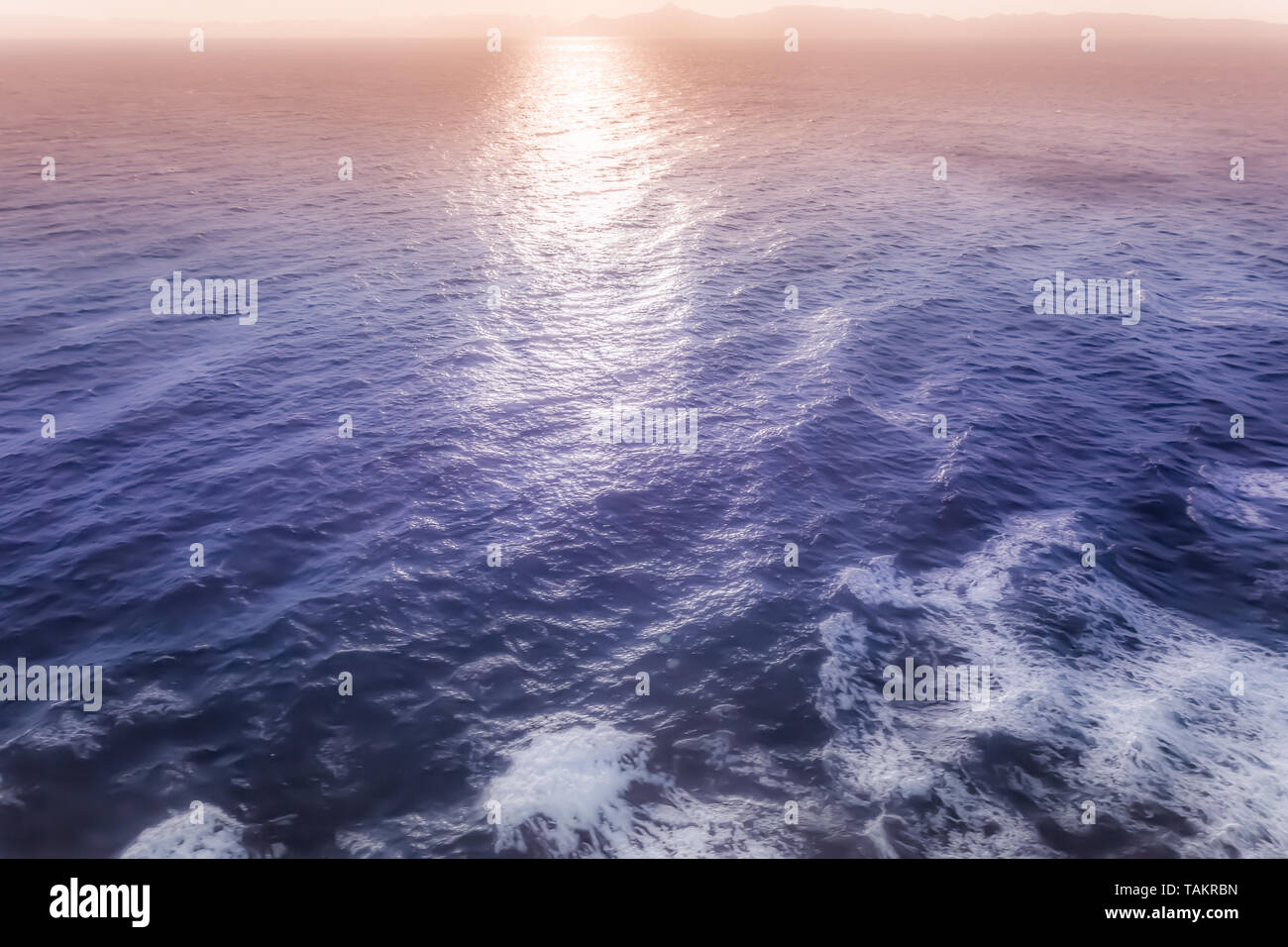 Magical sunset reflections over the sea with islands of Saronic Gulf ...