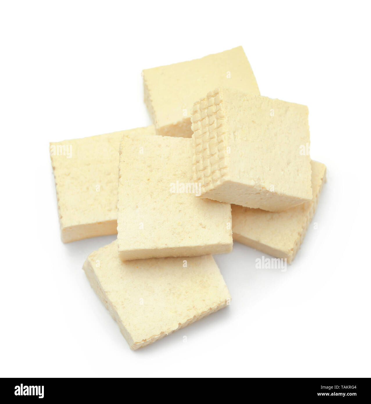 Cut tofu cheese on white background Stock Photo - Alamy