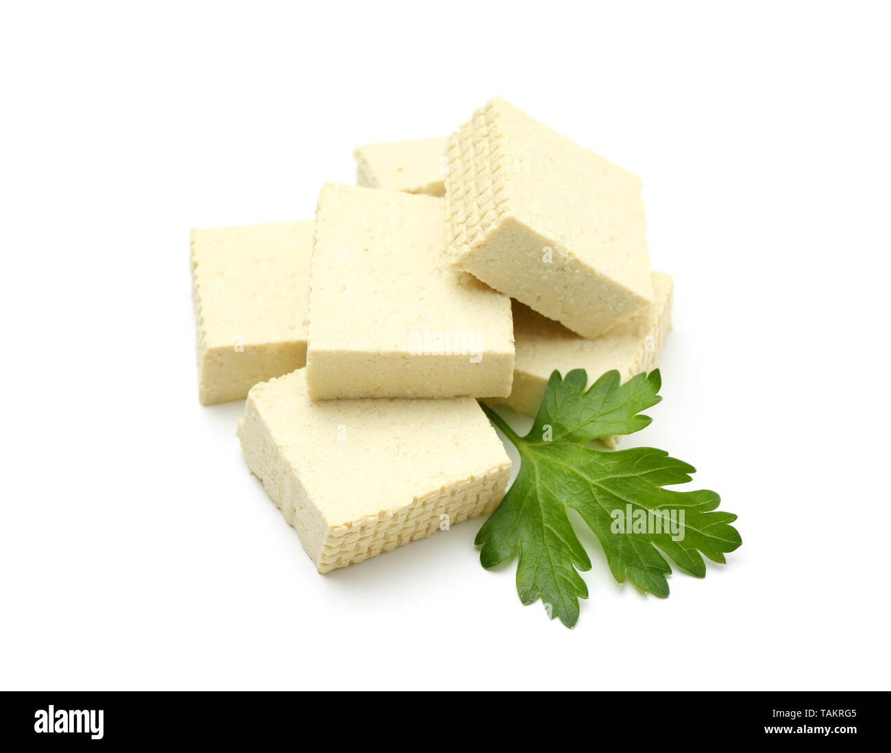 Cut tofu cheese on white background Stock Photo - Alamy