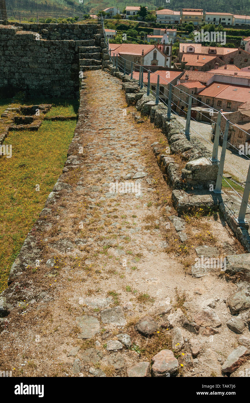 Pathway over stone wall with balustrade and rooftops at the Linhares da ...