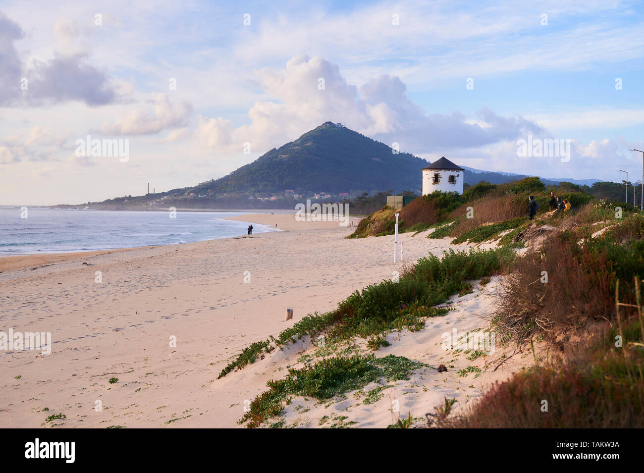 Beach of moledo at the end of the day, with a view to trega mountain on ...