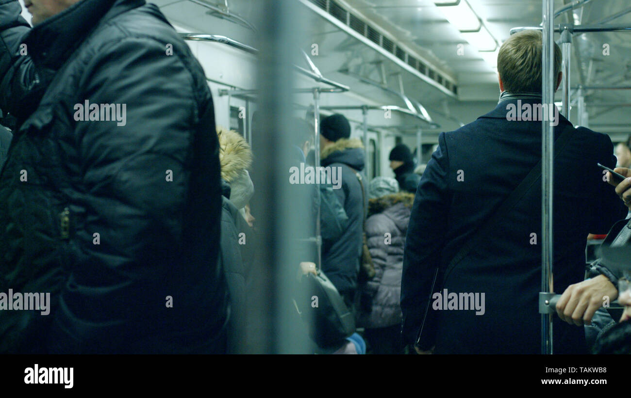 People in the subway. Passengers in underground train. People in public ...