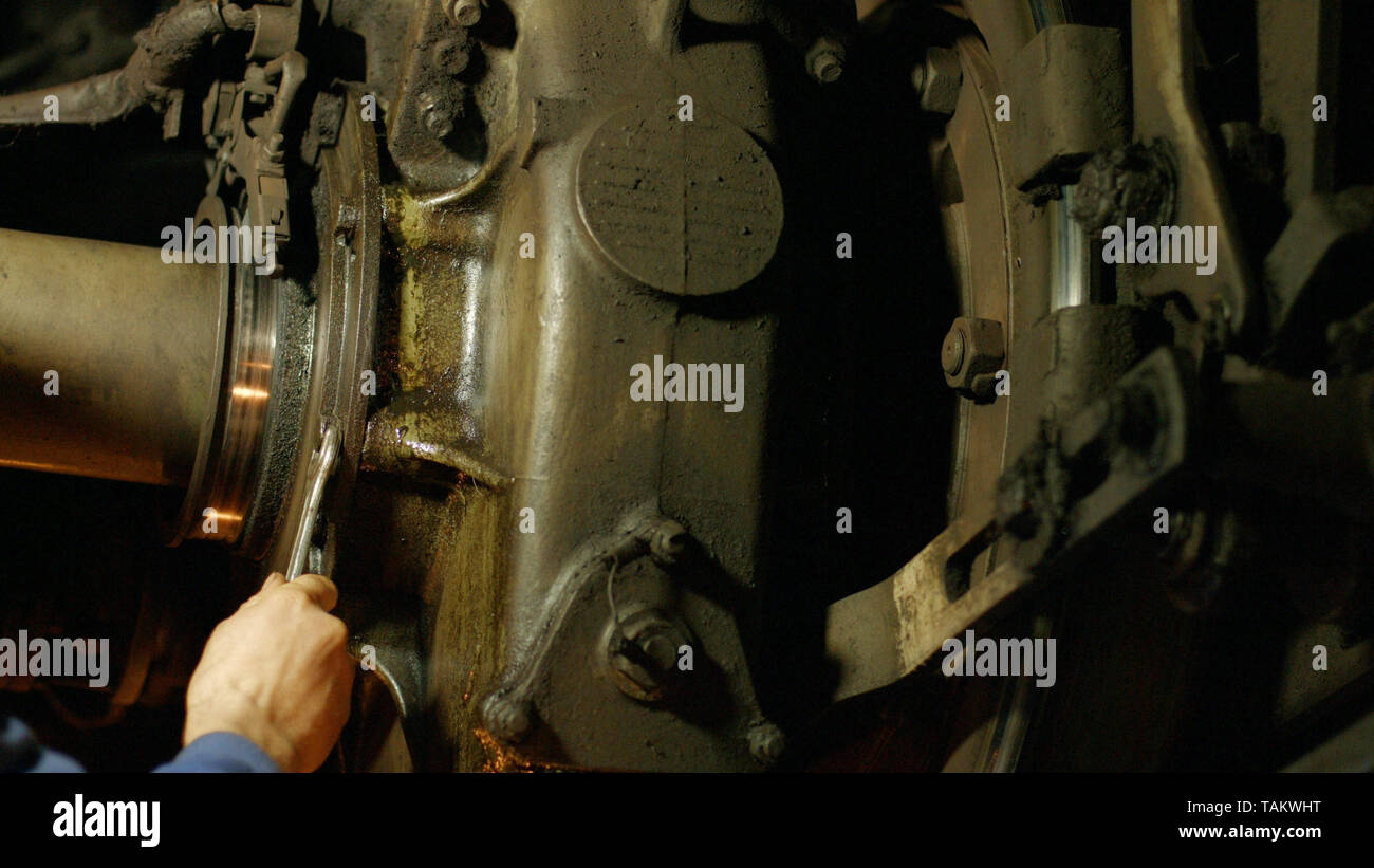 Mechanic repairing a car close up. Locomotive in the repair workshop ...