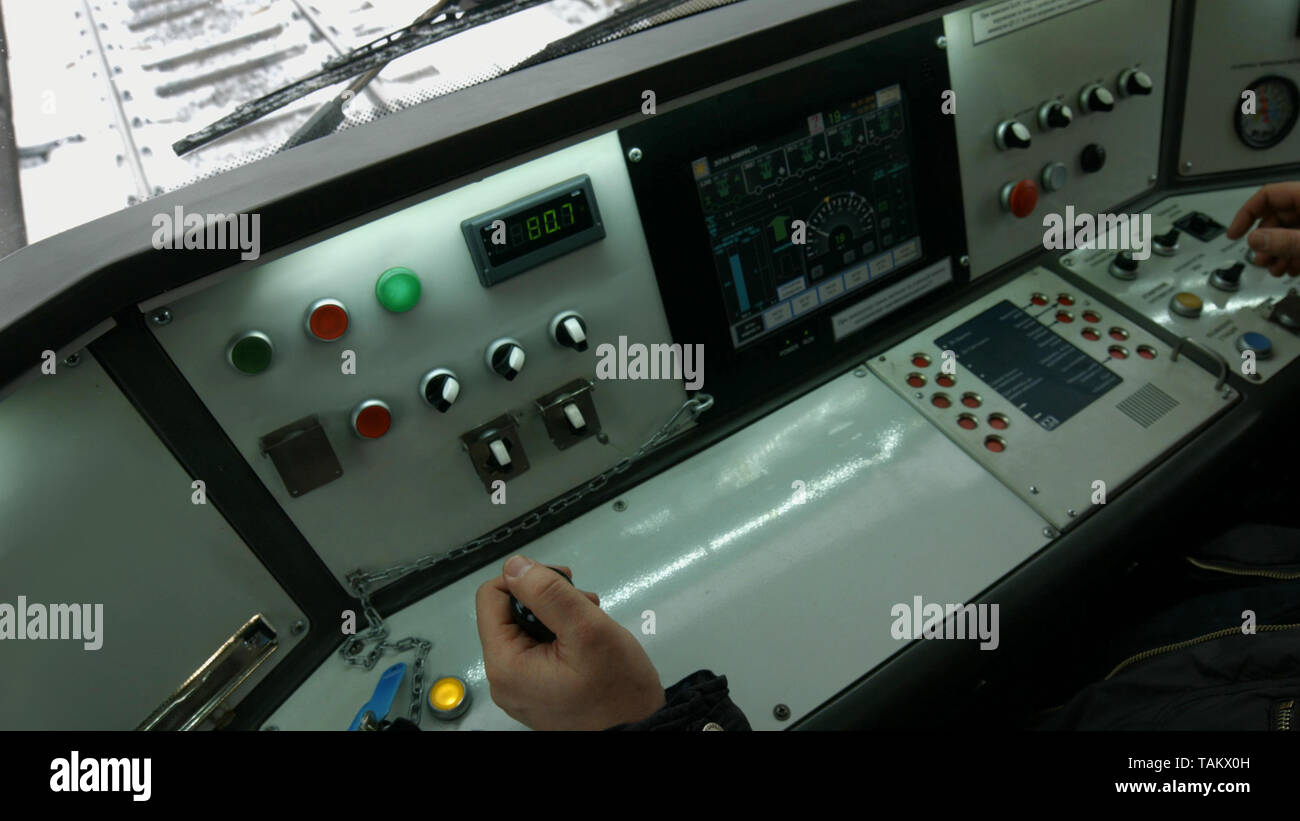 Drivers hand in the cab of train. Interior of a train drivers cab ...