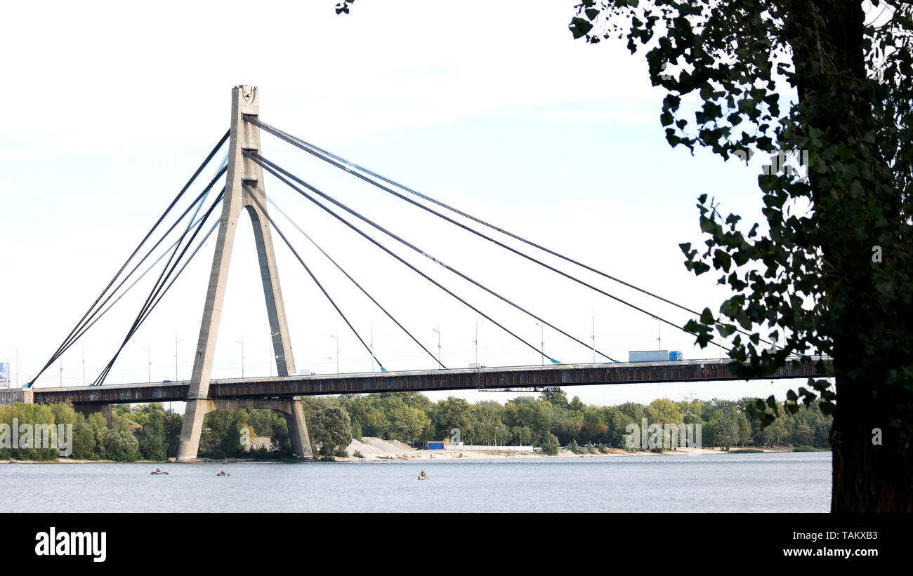 Modern bridge above river. Beautiful nature under bridge. Clear white ...