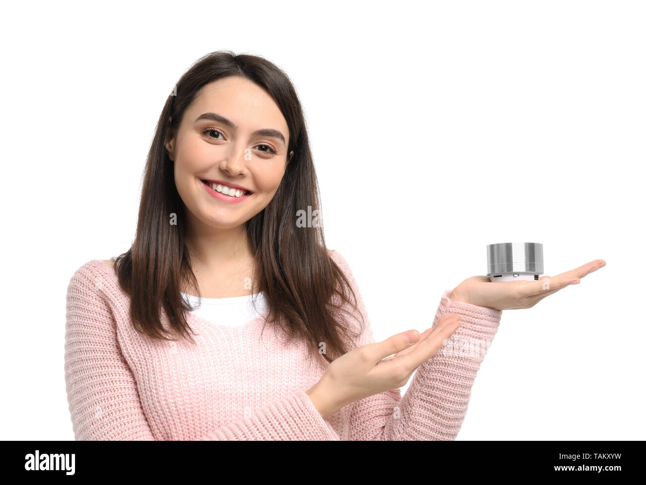 Young woman with smart home assistant device on white background Stock ...