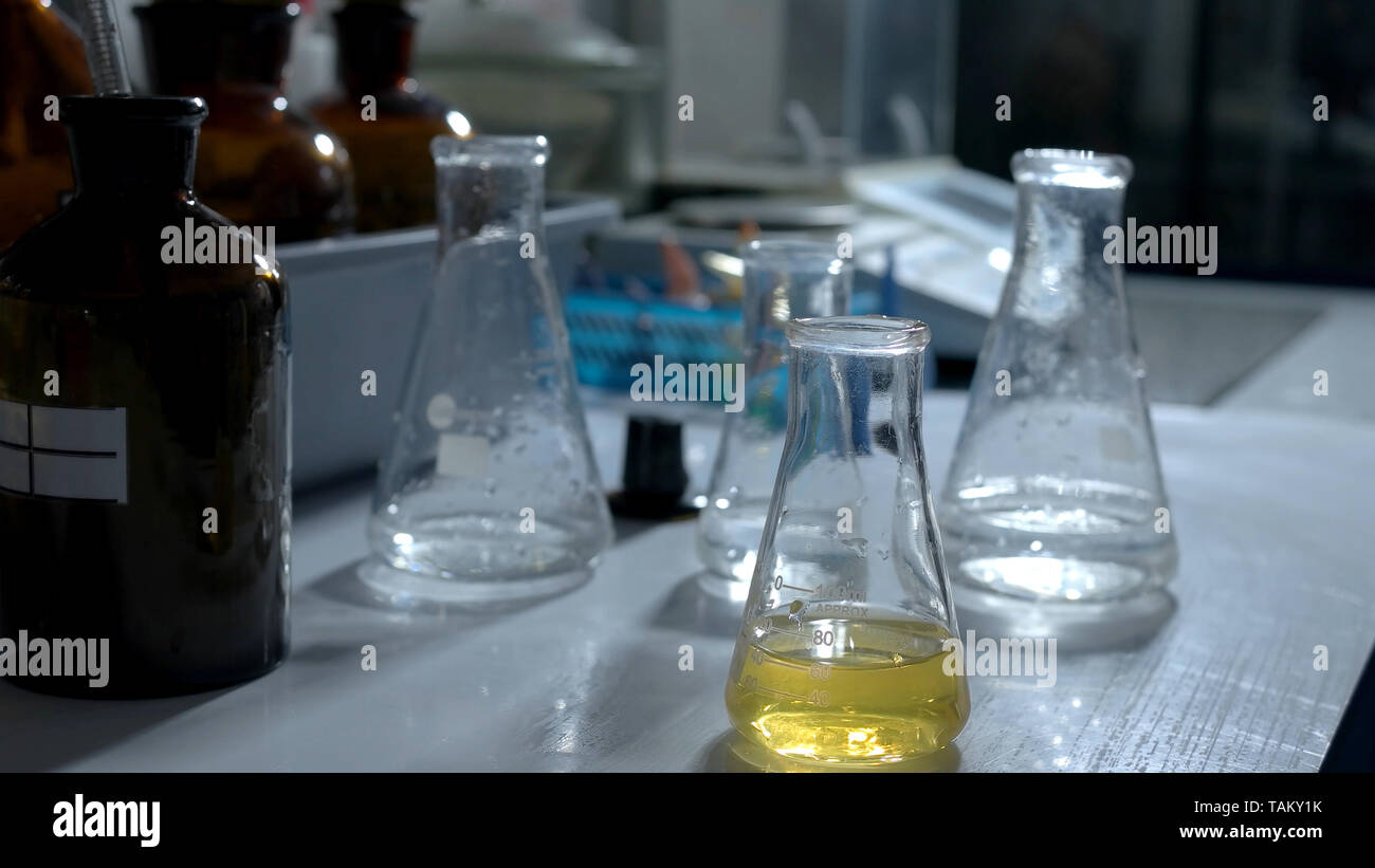 Lab flasks with chemical liquid. Laboratory glassware with color liquid ...