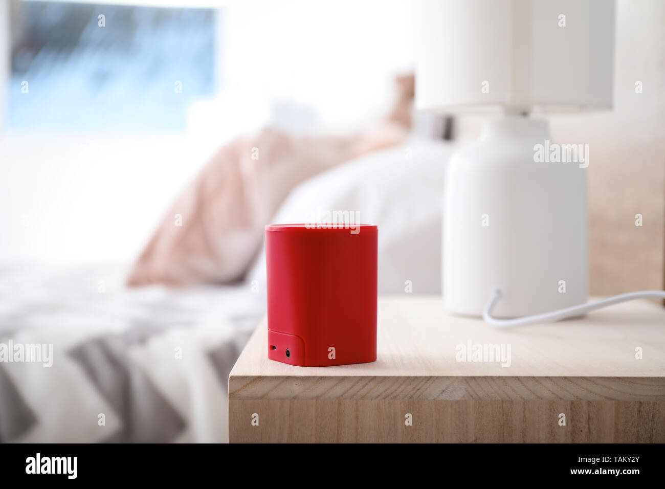 Smart home assistant device on table in bedroom Stock Photo - Alamy