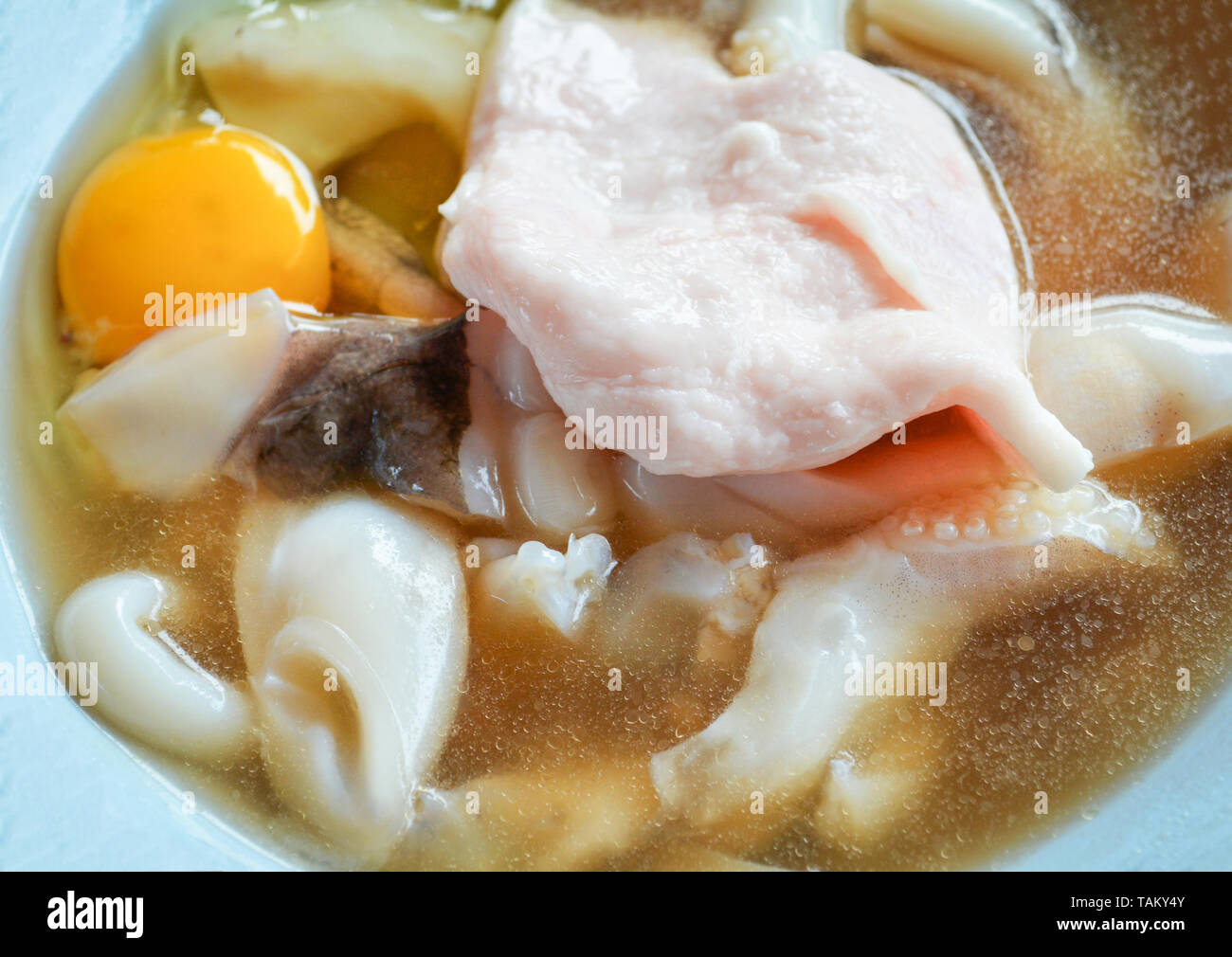 Fresh Squid slice with egg and pork lard seasoning with sauce / Raw ...