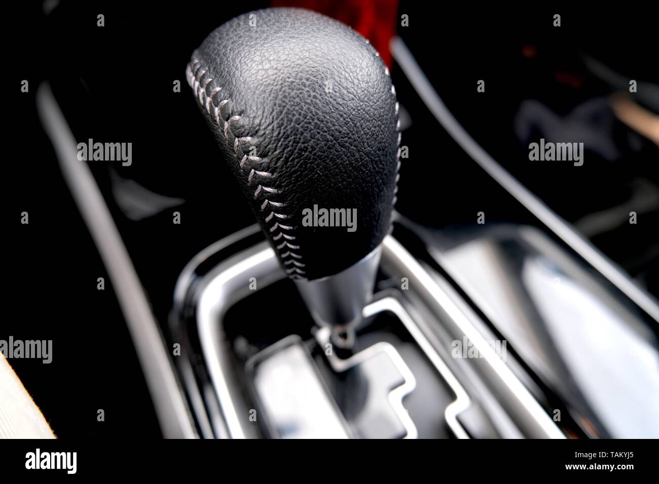 Sleek and Modern: Close-Up of a Chrome and Black Colored SUV Shifter ...