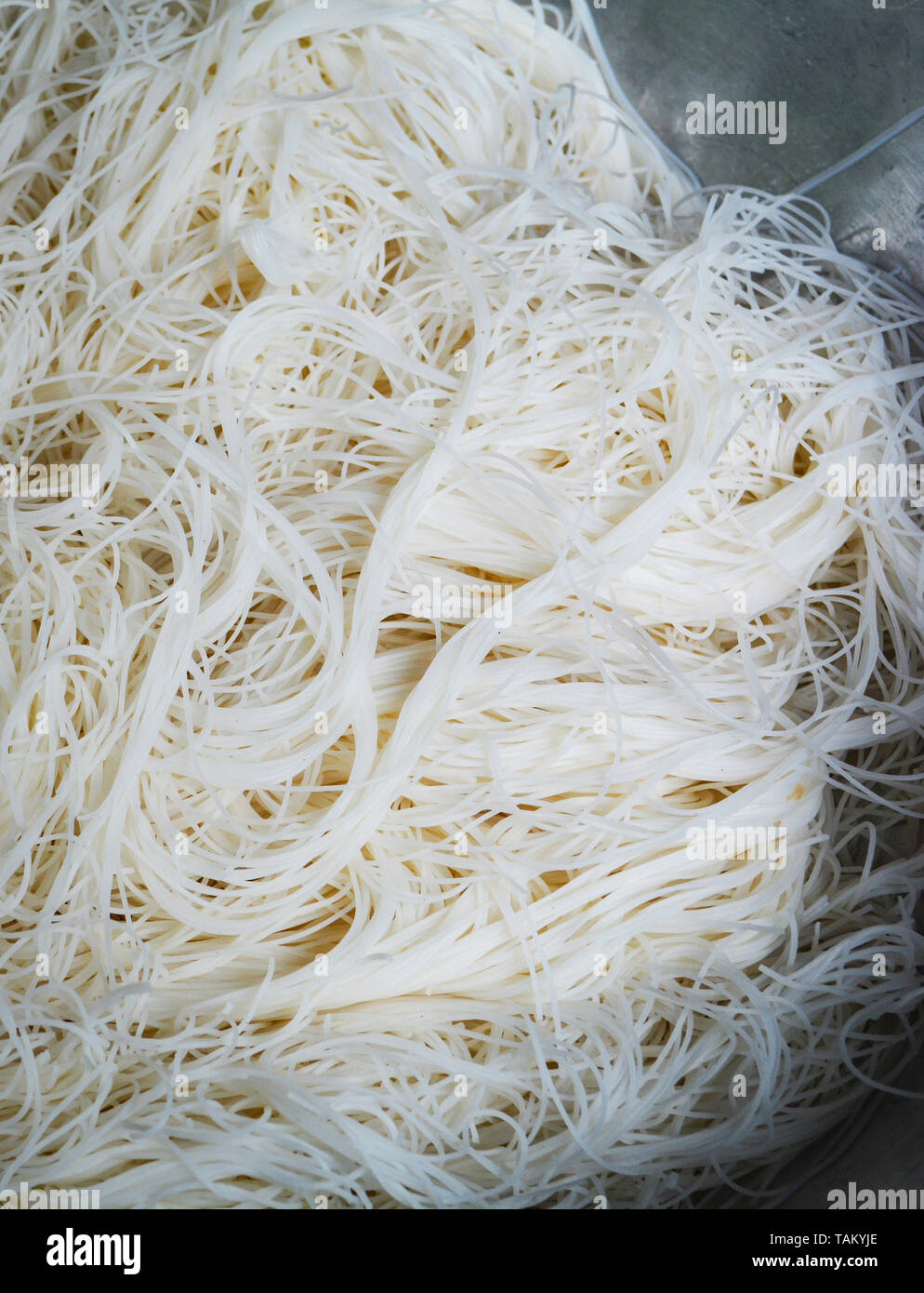 White rice vermicelli noodles for cook food on background Stock Photo ...