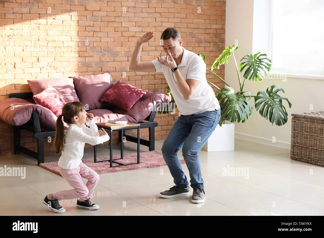 Father and his cute little daughter dancing at home Stock Photo - Alamy