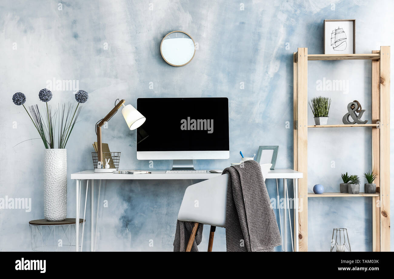 Stylish workplace with modern computer in interior of room Stock Photo ...