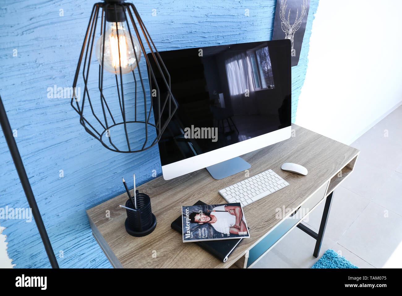 Stylish workplace with modern computer in interior of room Stock Photo ...