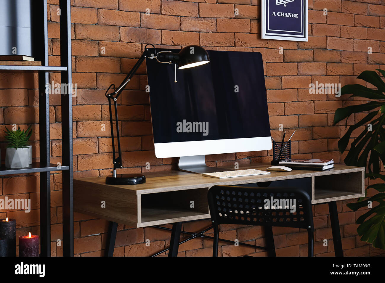 Stylish workplace with modern computer near brick wall Stock Photo - Alamy