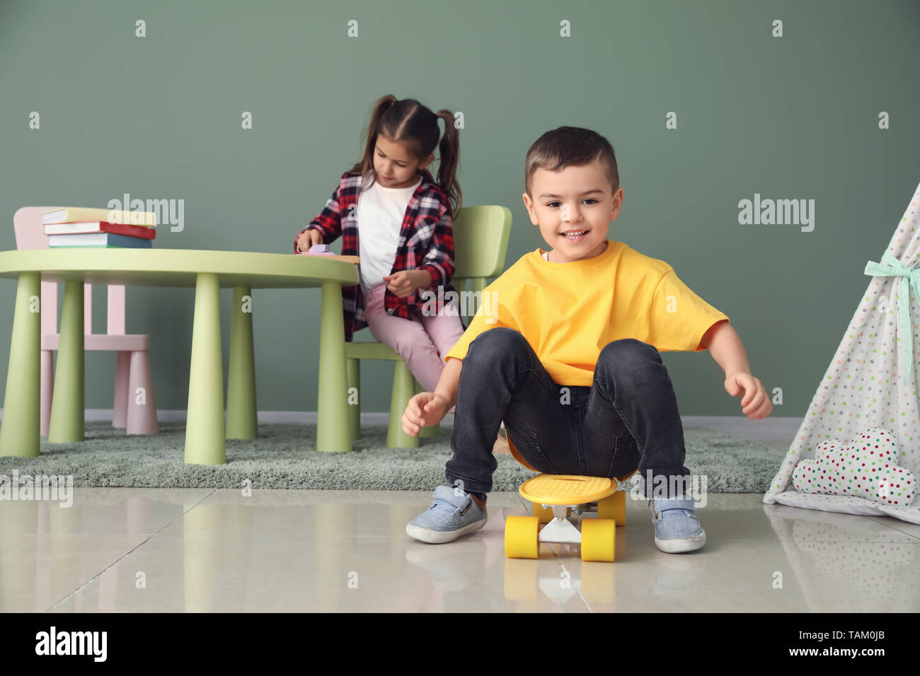 Cute little children playing at home Stock Photo - Alamy