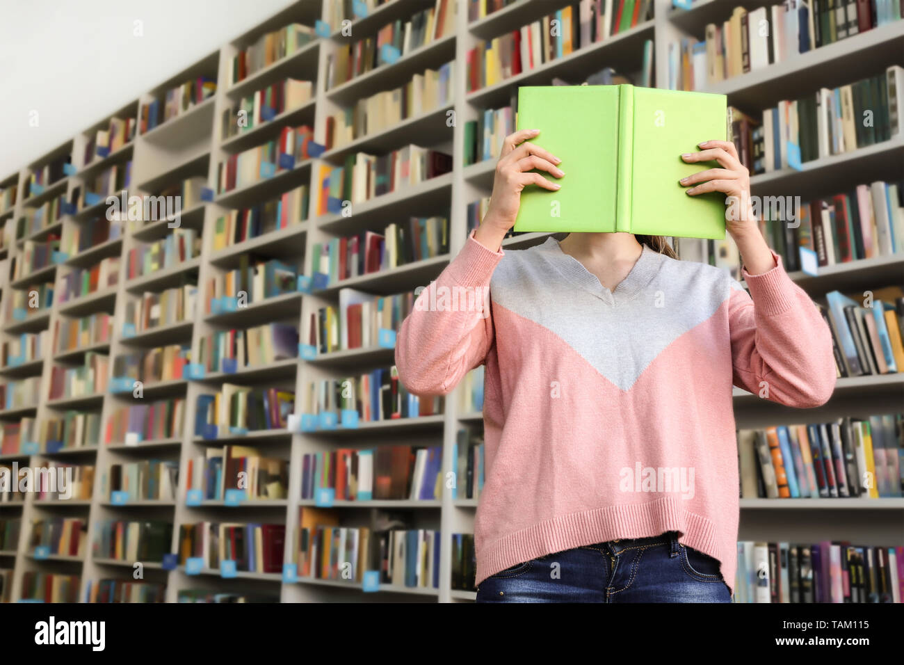 Girl Hiding Face With Book