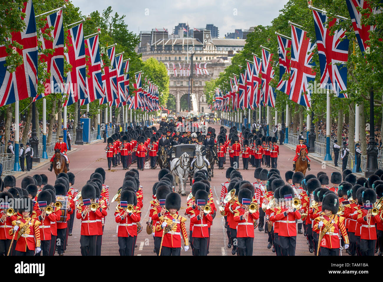 London, UK. 25th May 2019. Guardsmen march along The Mall after ...