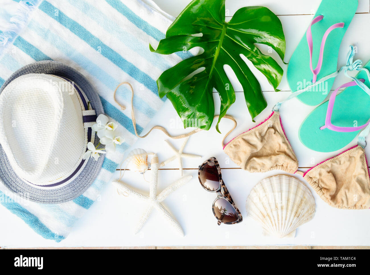 Summer flat lay scenery with beach accessories on white wooden ...