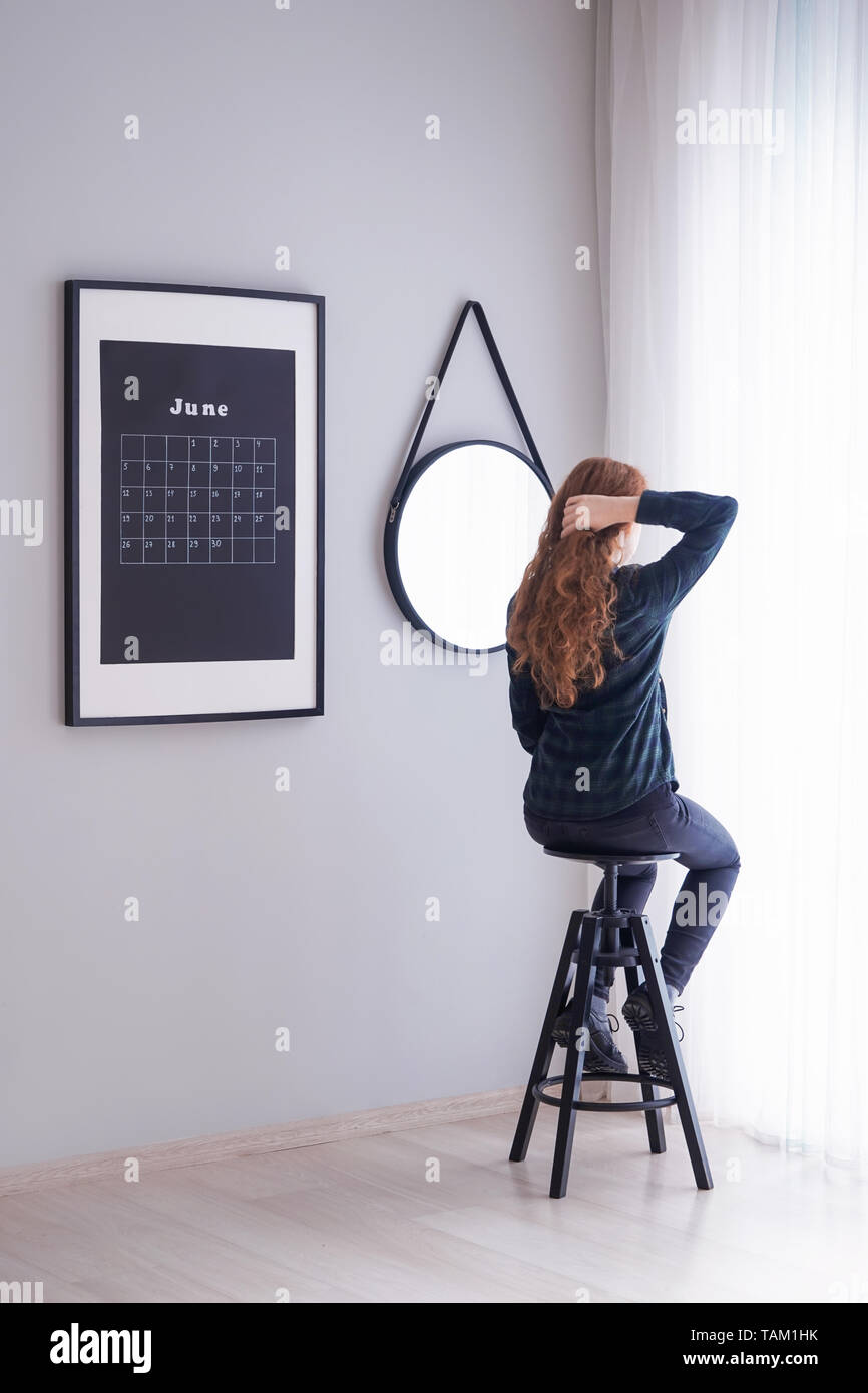Woman sitting stool page hi-res stock photography and images - Alamy