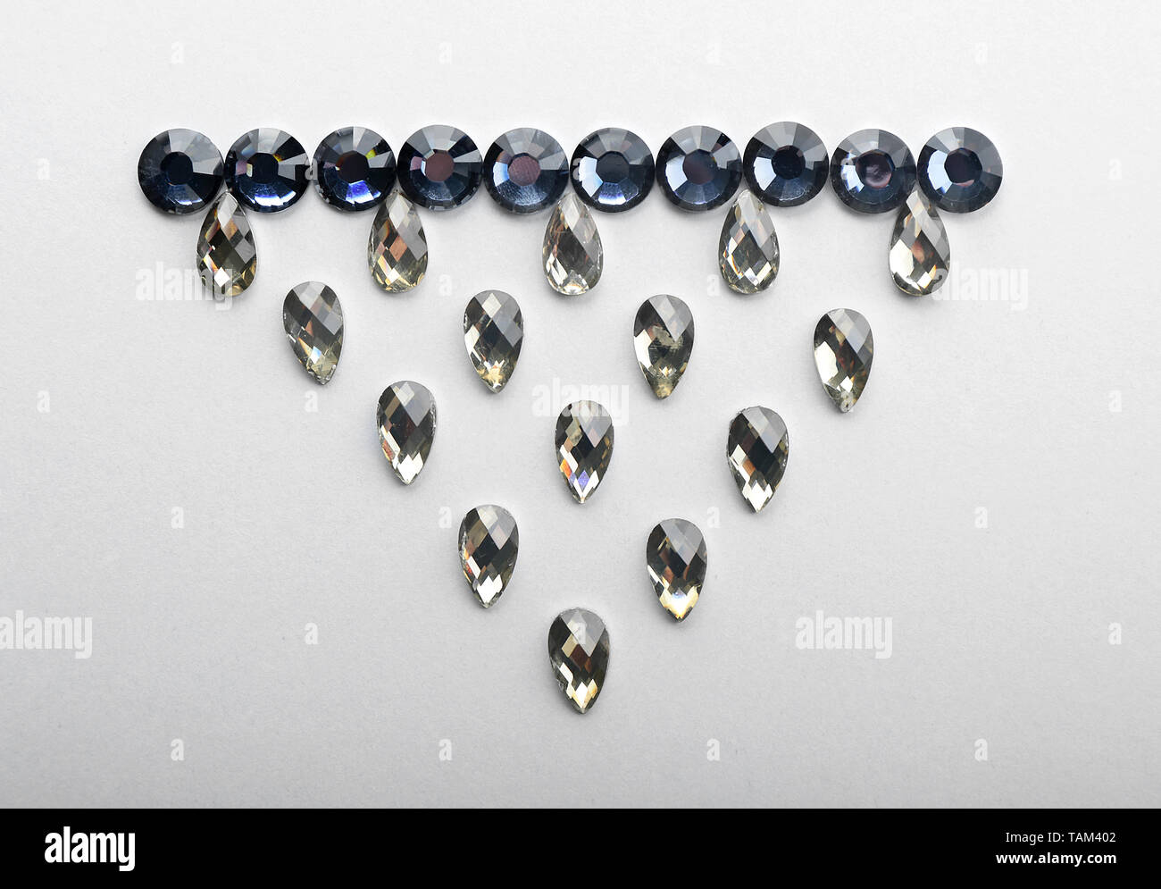 Composition with precious stones for jewellery on white background ...