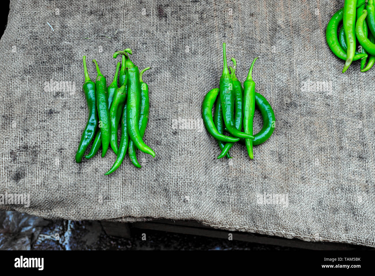 Green peppers in a burlap on the market in Fez. Morocco Stock Photo - Alamy