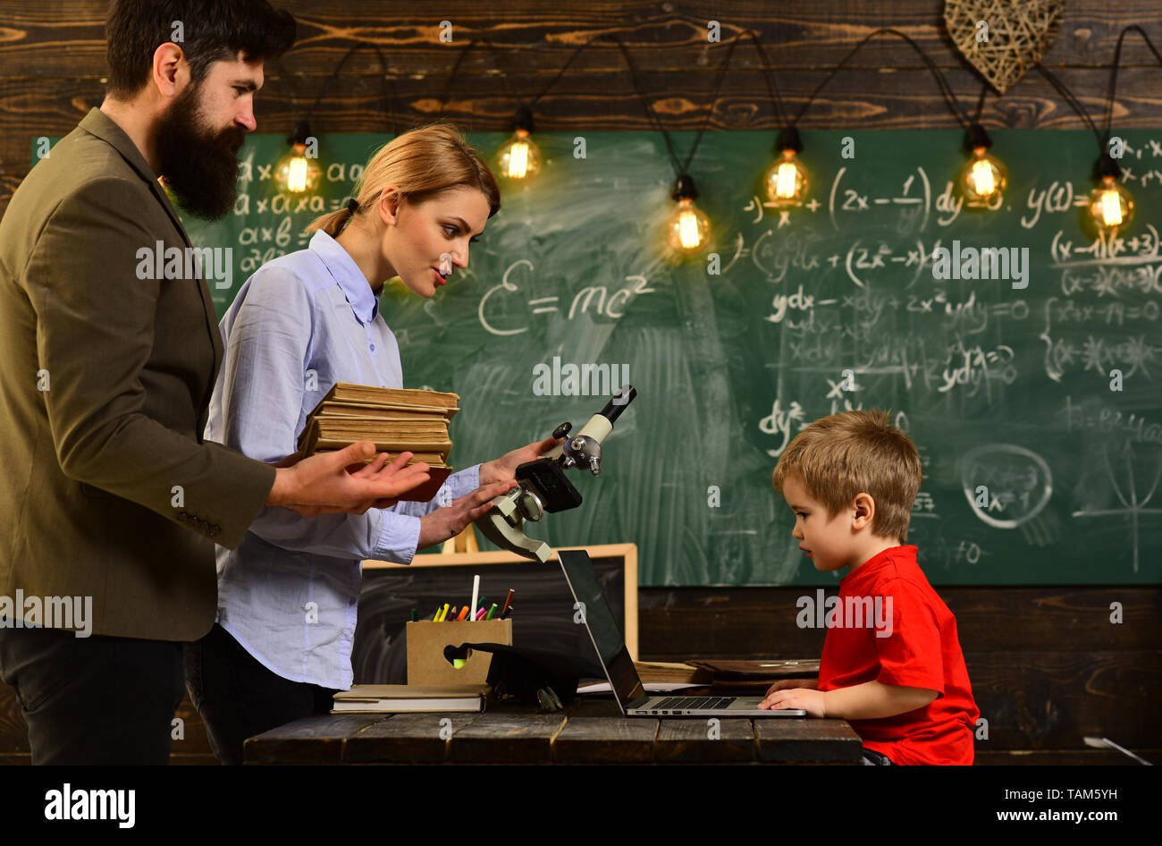 Business tutor typing on laptop at workplace in classroom, Back to ...
