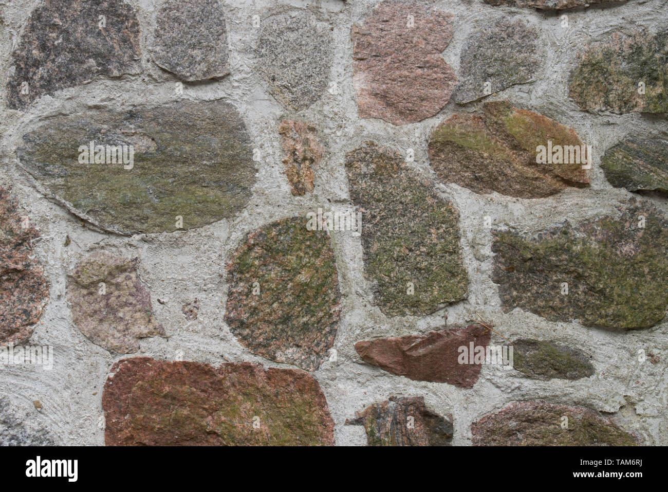 irregular stone wall background texture Stock Photo - Alamy