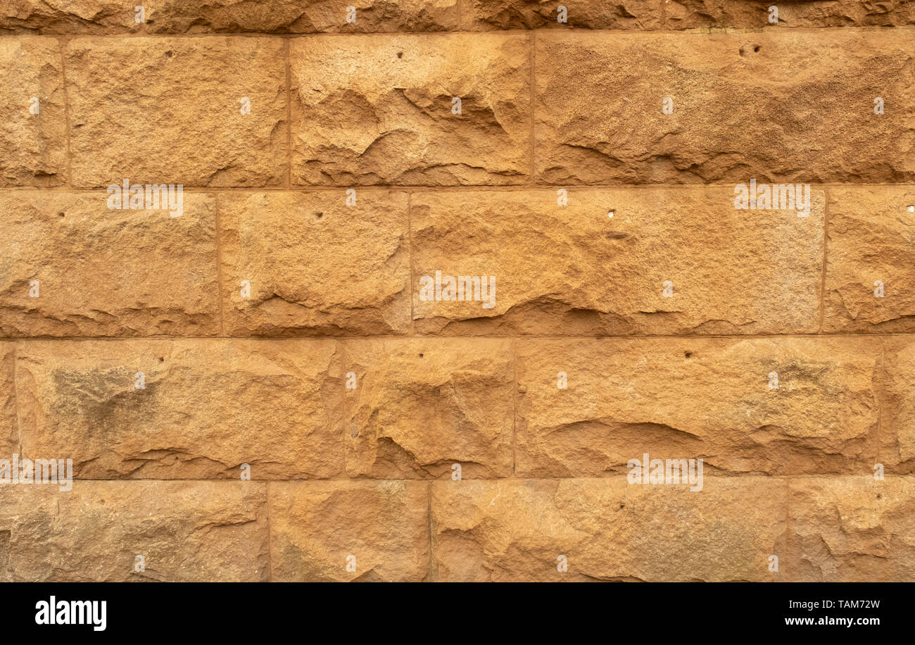 Close up of large block sandstone wall with small holes Stock Photo - Alamy