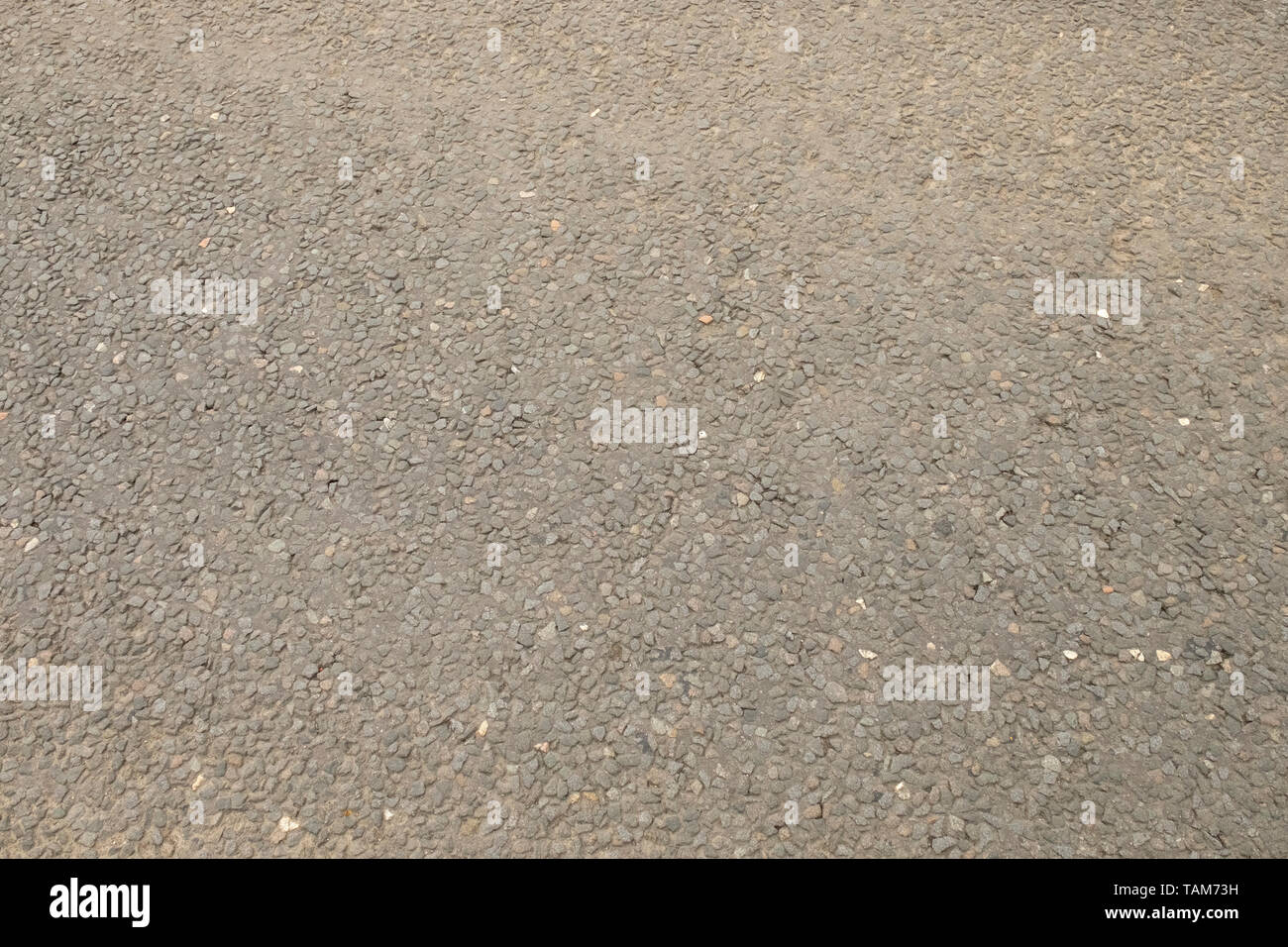 Close up of road surface - tarmac plus embedded gravel Stock Photo - Alamy