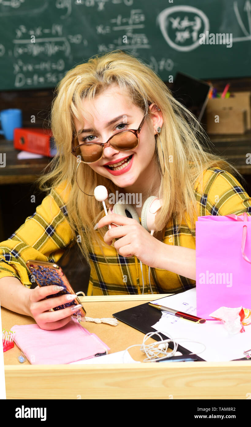 High school or college students studying and reading together in ...